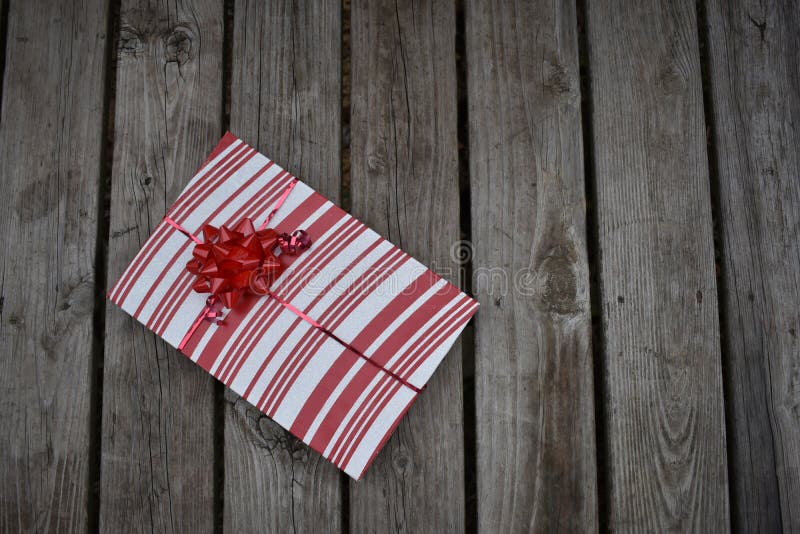 A Red and White Gift on Wood Slats Stock Image - Image of gift, space ...