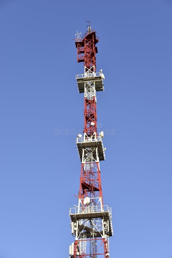 Red and White High Rise Communication Tower Antenna in the City with ...
