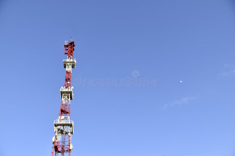 Red and White High Rise Communication Tower Antenna in the City with ...