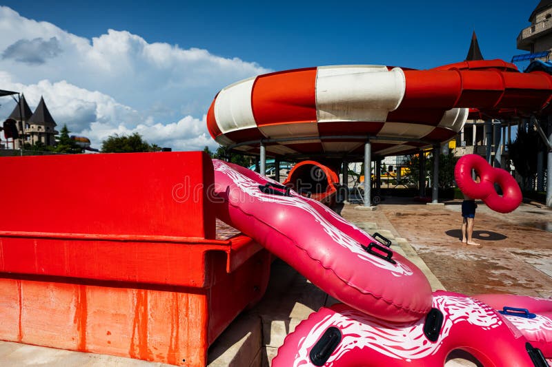 Red and White Inflatable Slides for Children on the Aqua Park Stock ...