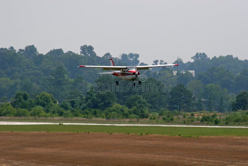 Small Plane Landing 1 stock photo. Image of depart, airplane - 964226