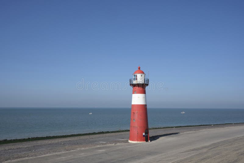 Red and White Lighthouse on a Blue Sky Background, Westkapelle in the ...