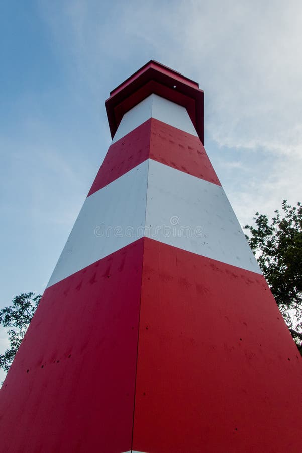 Lighthouse in the Forest among the Trees. Red and White Lighthouse ...