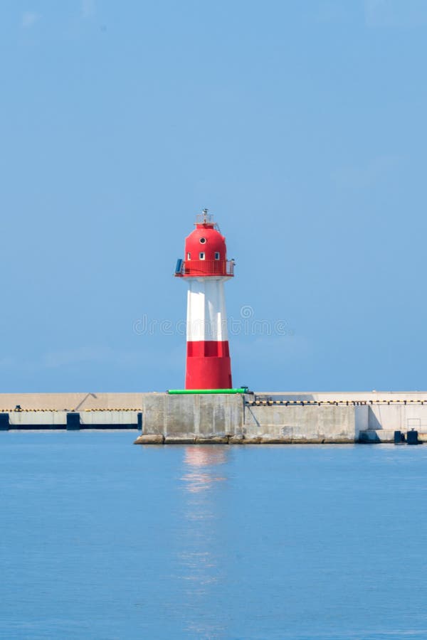 Red-white Lighthouse at Sea Stock Photo - Image of coast, landscape ...