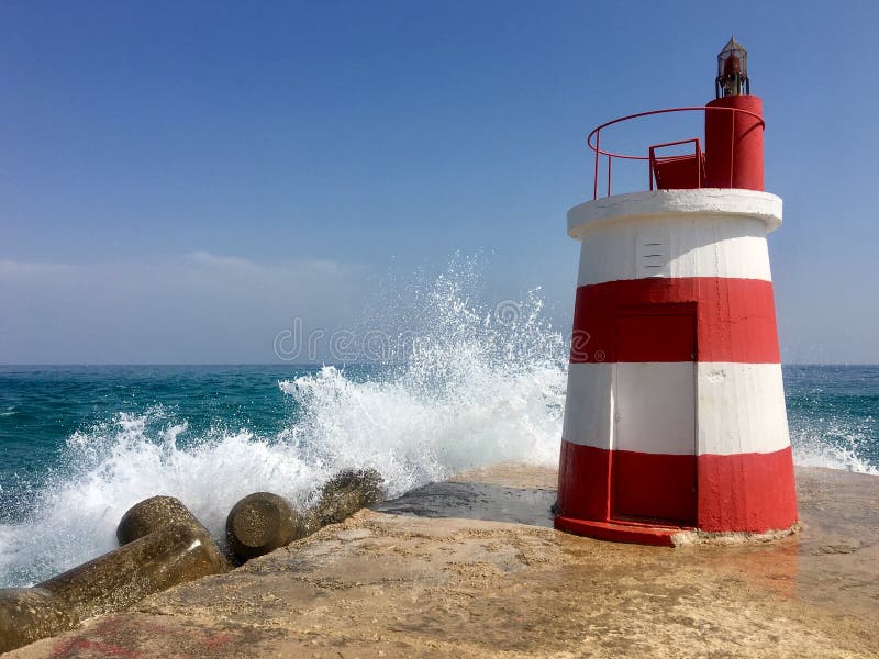 Red and white Lighthouse stock image. Image of cloud - 143142223