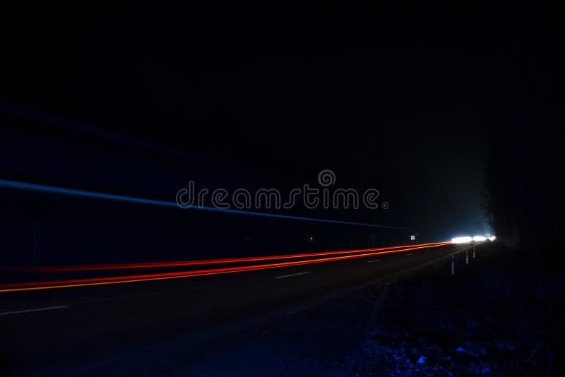 Red and White Lights from Passing Cars. Night Highway. Stock Image ...