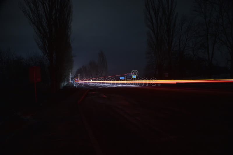 Red and White Lights from Passing Cars. Night Highway. Stock Photo ...