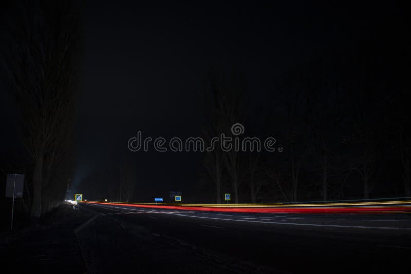Red and White Lights from Passing Cars. Night Highway. Stock Photo ...