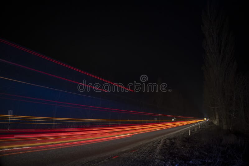 Red and White Lights from Passing Cars. Night Highway. Stock Photo ...