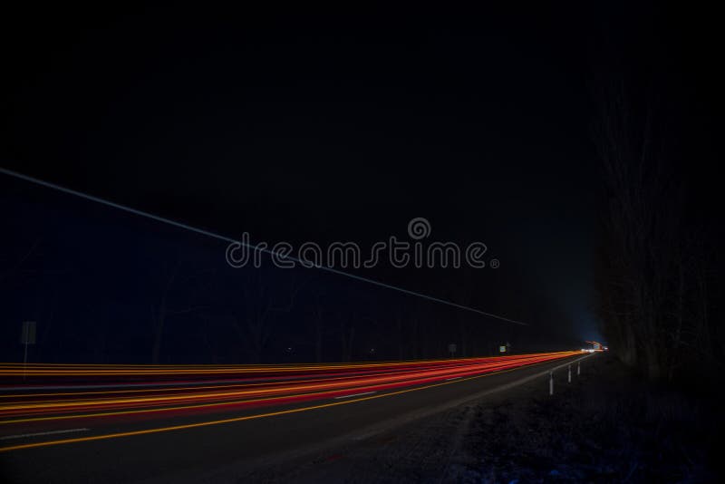 Red and White Lights from Passing Cars. Night Highway. Stock Photo ...