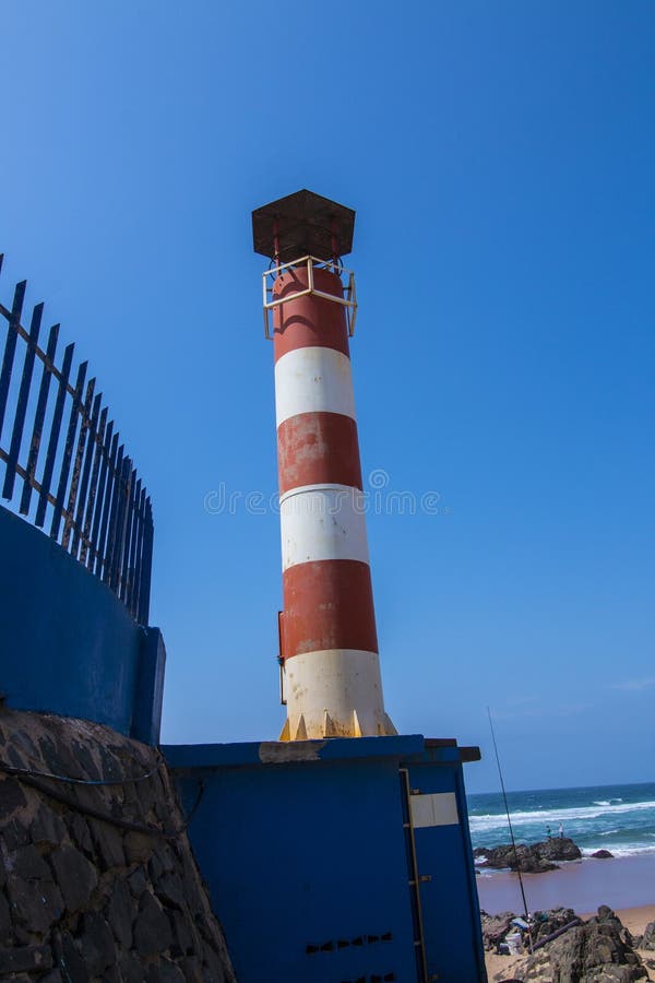 Red and White Lookout Tower Erected on Shoreline Stock Photo - Image of ...