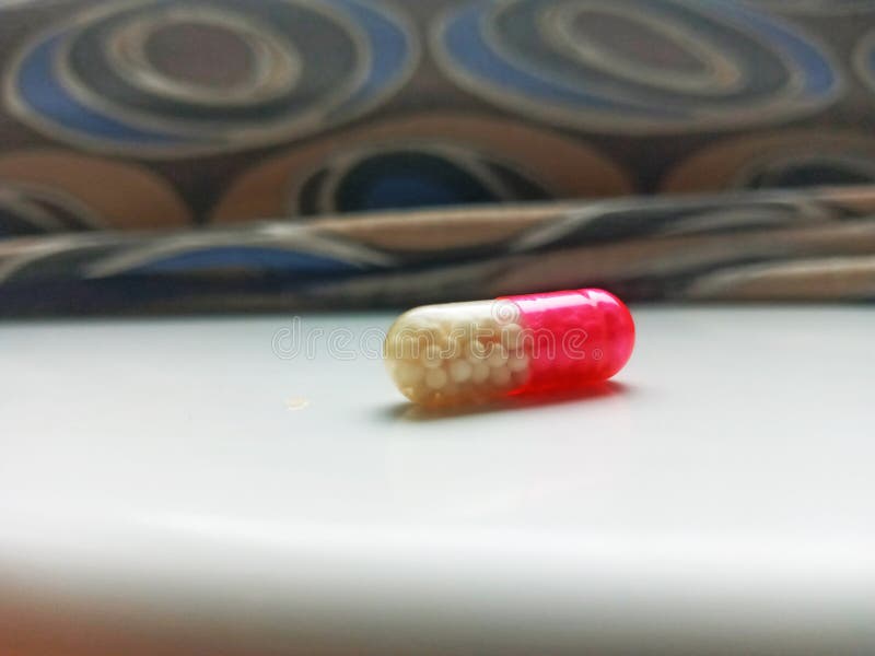 Red White Medical Capsule with Granules Inside Stock Photo - Image of ...