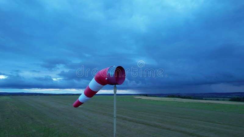 A Red and White Meteorological Wind Vane Indicates the Strength and ...
