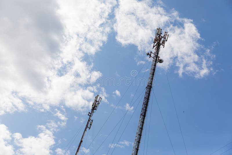 Red and White Mobile Phone Cell Tower Repeater, with a Small Microwave ...