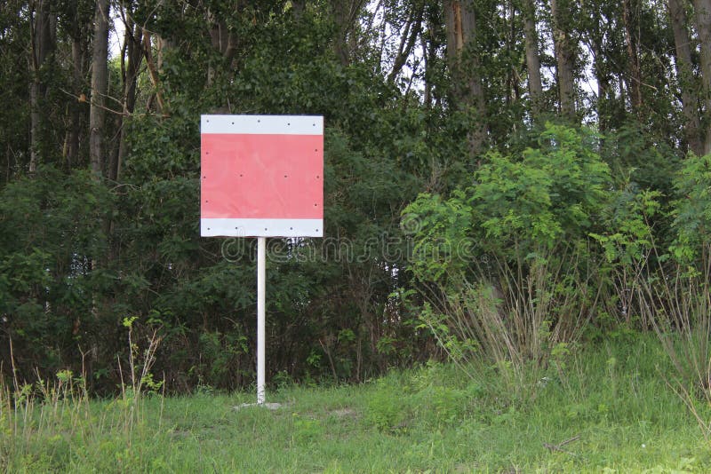 Red and White Panel at the Edge of the Forest Stock Image - Image of ...