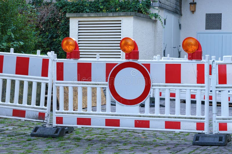 Red and White Plastic Portable Barrier in Front of a Construction Site ...