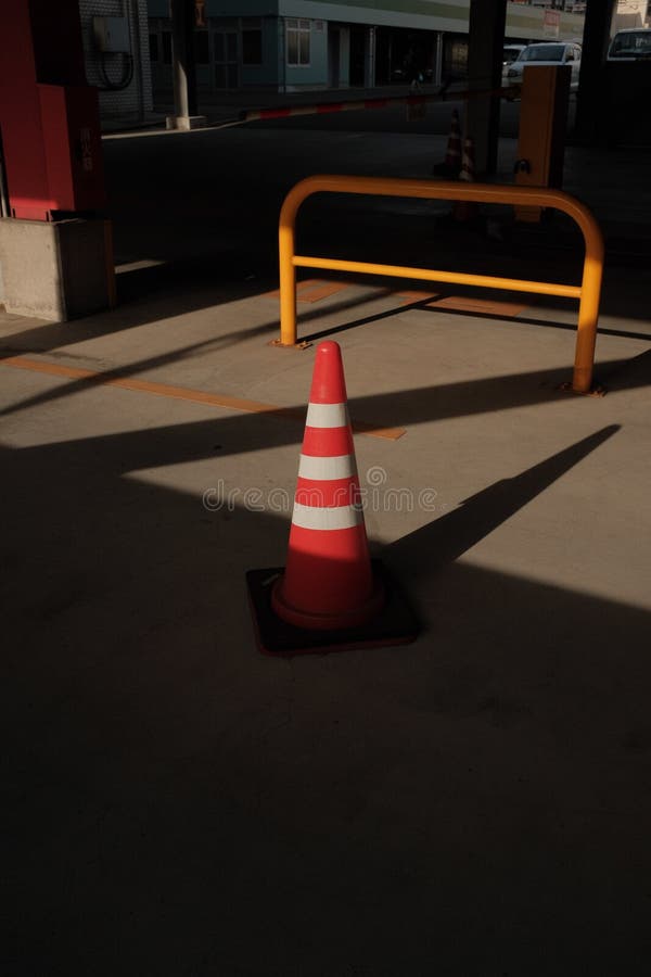 Red and White Road Warning Cone on the Ground Under the Sunlight Stock ...