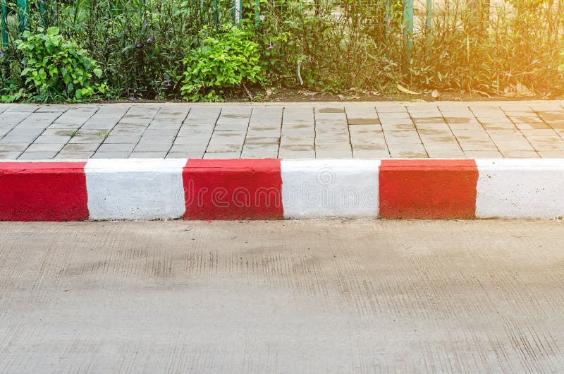 Red and White Sign on the Sidewalk Background Stock Photo - Image of ...
