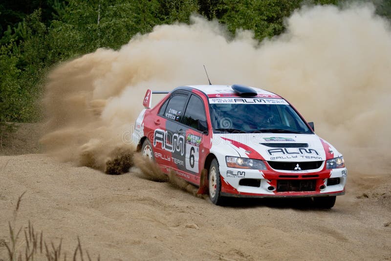 Red and White Sportcar Mitsubishi Lancer Editorial Photography - Image ...