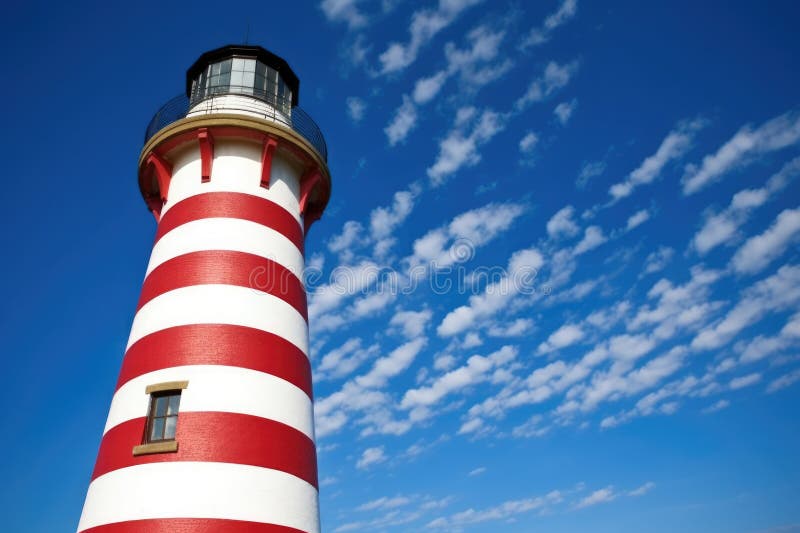 Red-and-white Striped Lighthouse Against Clear Blue Sky Stock Photo ...