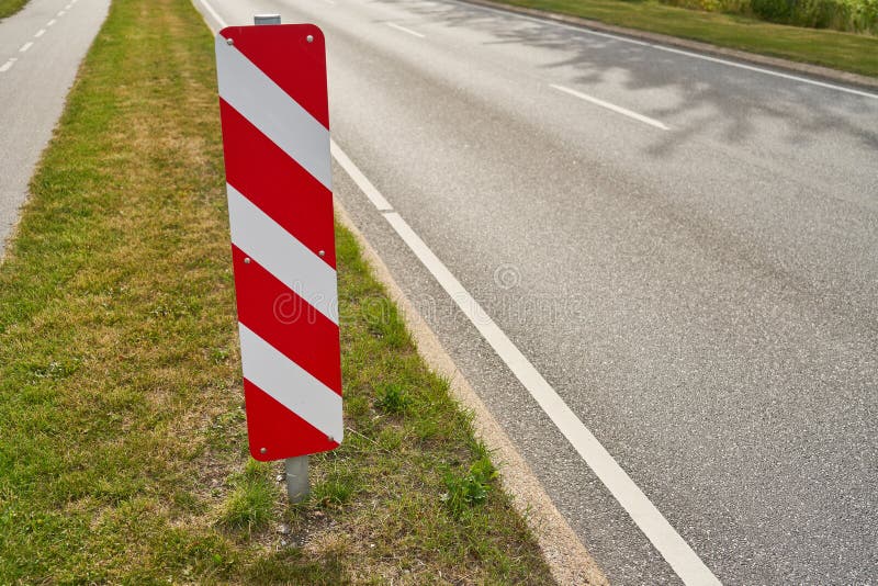 Red and White Striped Traffic Sign on Road As Safety Warning Stock ...