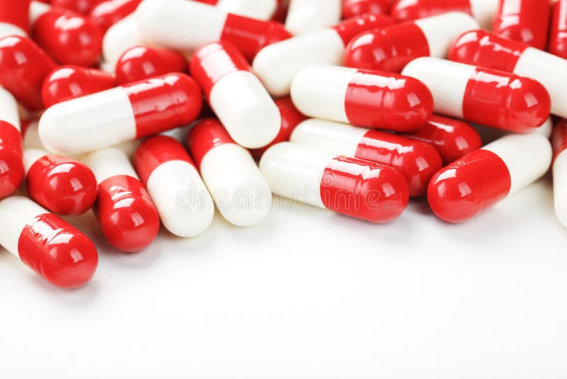 Red and White Tablets on a White Background with Free Space. Stock ...