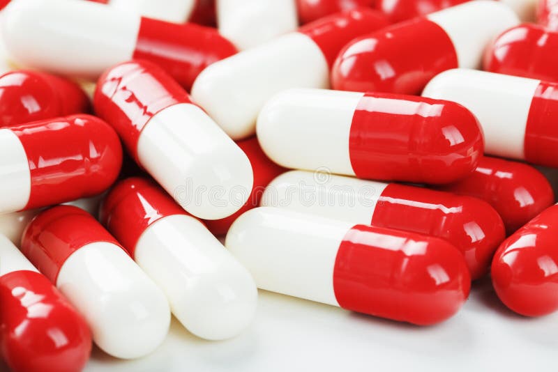 Red and White Tablets on a White Background with Stock Photo - Image of ...