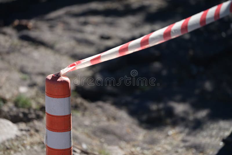 Red and White Tape Stretched in Front of Danger Zone Closeup Stock ...