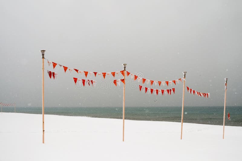 Red and White Triangle Flags the Beach Covered with Snow Stock Photo ...