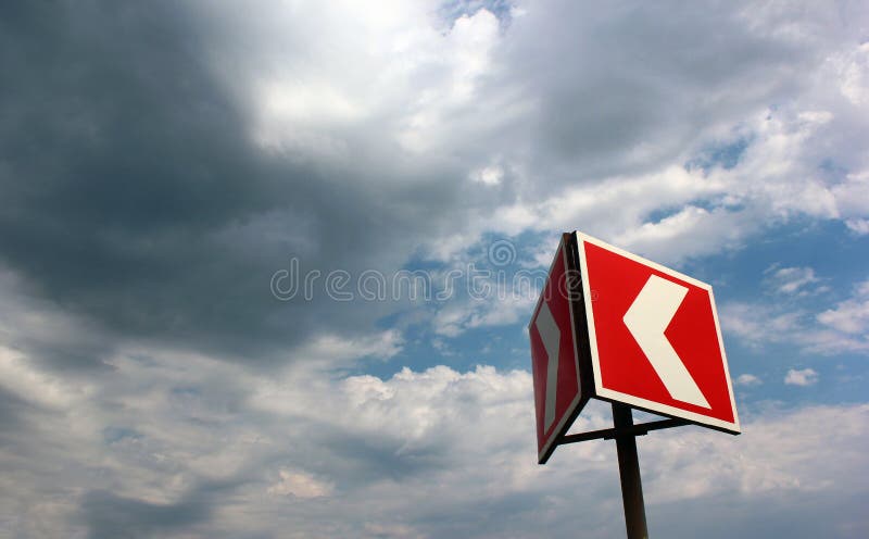 Red and White Warning Arrow on Cloudy Sky Background Stock Photo ...