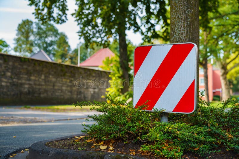 Red and White Warning Sign in Front of an Obstacle on the Road Stock ...