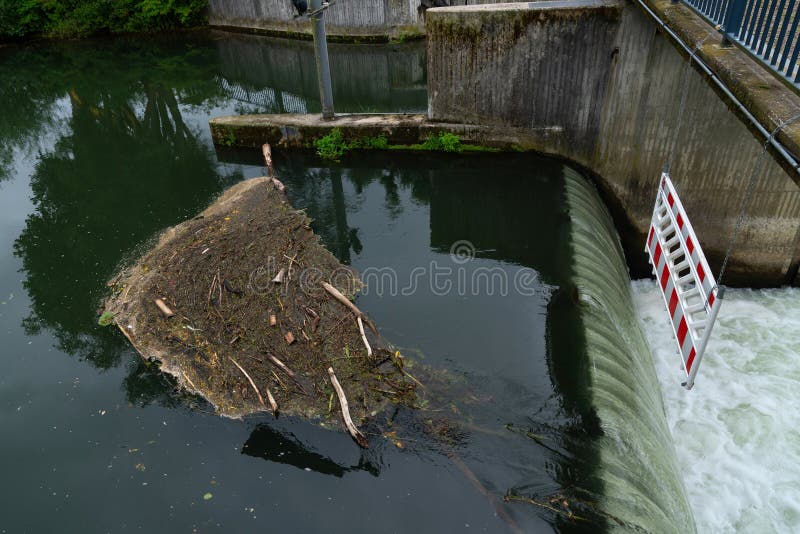 A Red and White Warning Sign Hangs Above the Dam. Stock Photo - Image ...