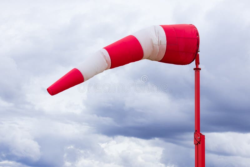 Red and White Weather Vane and Dramatic Cloudy Sky Stock Photo - Image ...
