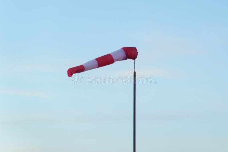 A Red and White Wind Cone Indicating the Direction and Strength of the ...