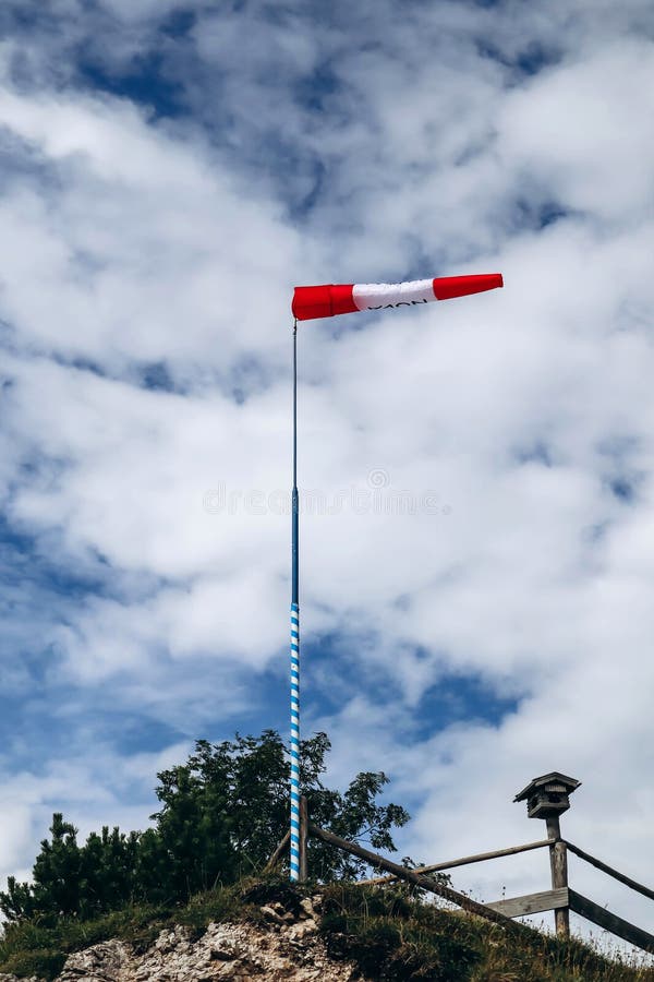 Red and White Wind Indicator Cone with Blue Sky Stock Photo - Image of signal, wind: 348404484