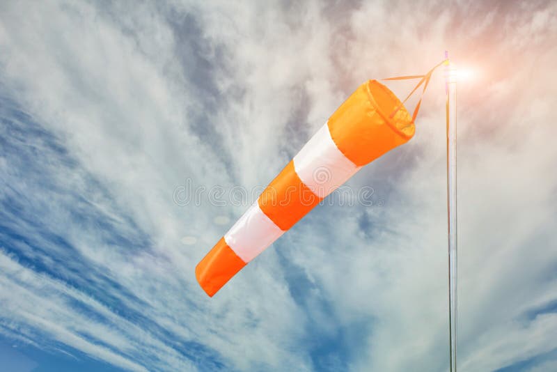 Red and White Wind Sock on Blue Sky and Clouds Background Stock Image ...