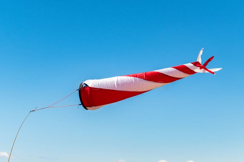 Red and White Windsock on a Background of Blue Sky Stock Image - Image ...