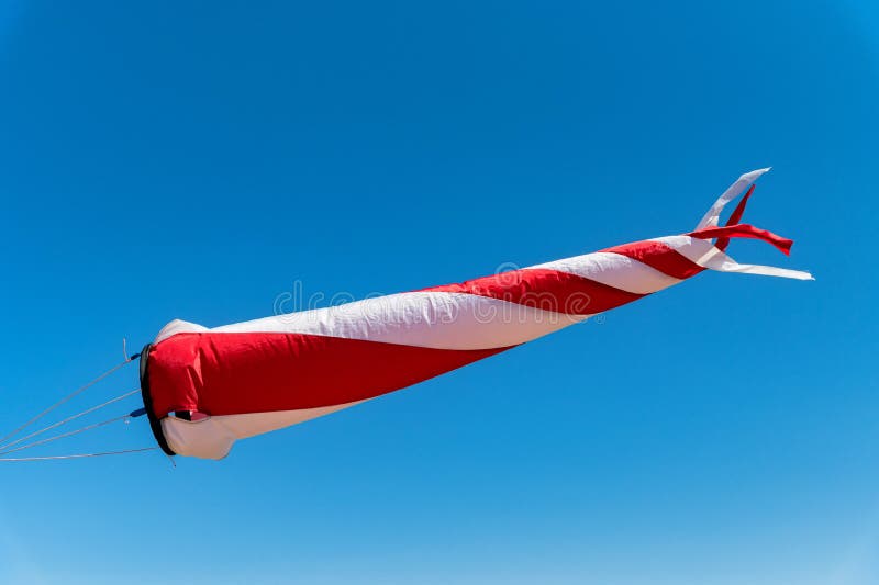 Red and White Windsock on a Background of Blue Sky Stock Image - Image ...
