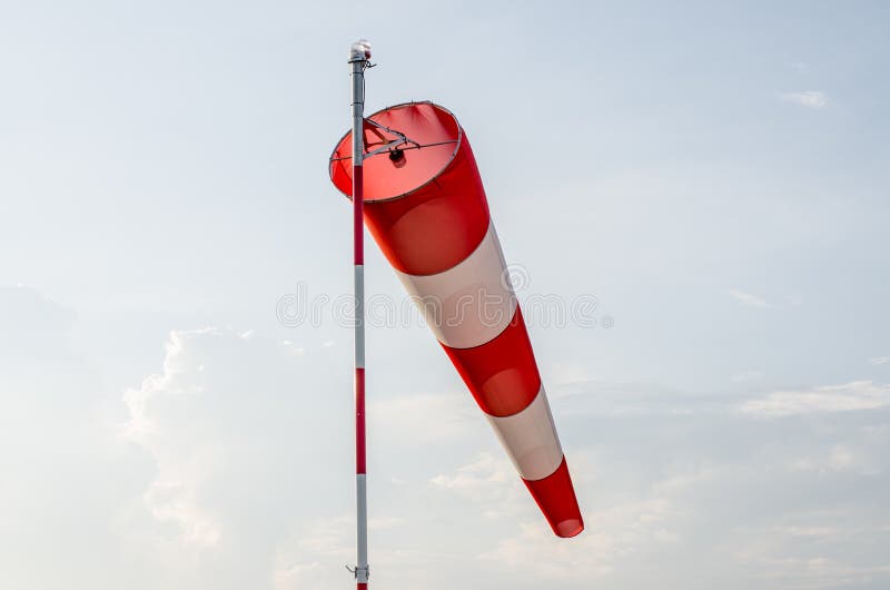 Red and White Windsock Inflated by the Wind Blows Stock Photo - Image ...