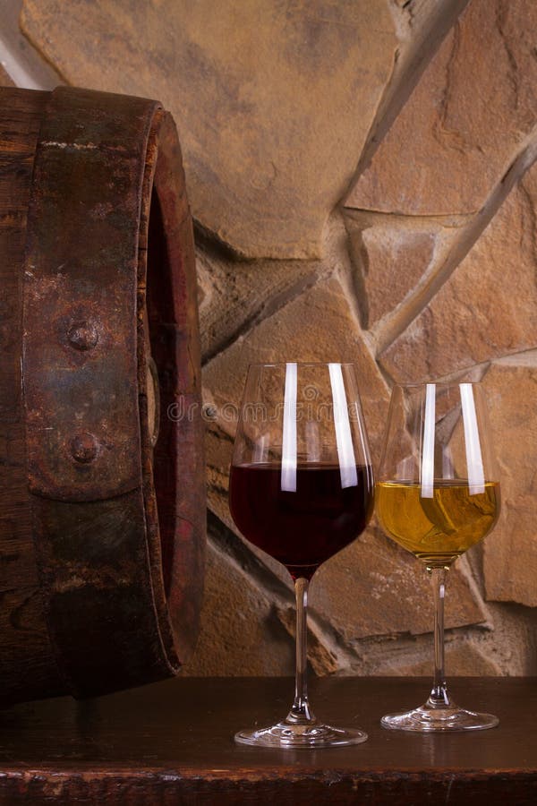Red and White Wine beside Old Cask in Wine Cellar. Stock Image - Image ...