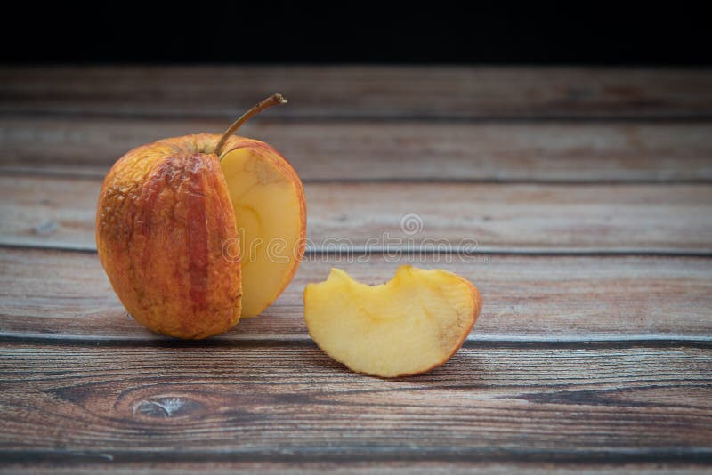Red Wilted Rotten Apple on a Table. Bacteria Infected Rotten Fruit ...