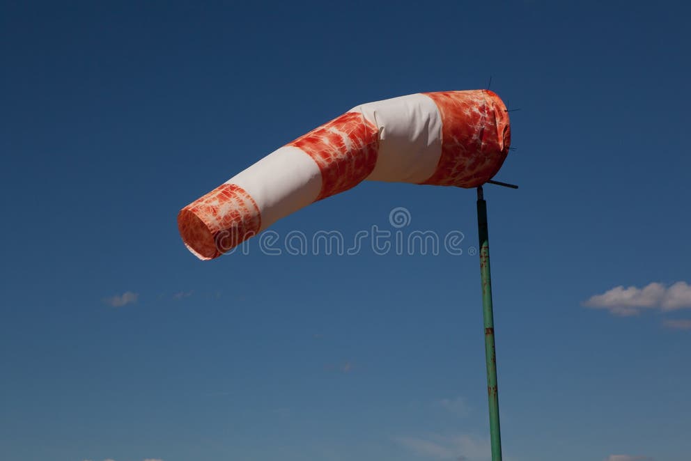 Red Wind Vane Against a Blue Sky Stock Photo - Image of airport, flying ...