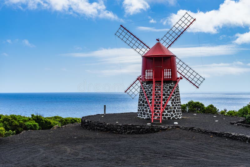 Red Windmill on Pico Coastline with Blue Clear Sky in Azores Stock ...