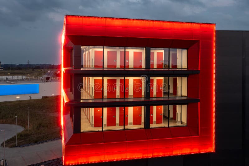 Red Windows with Neon Illumination at Night, a Bright Building in Red ...