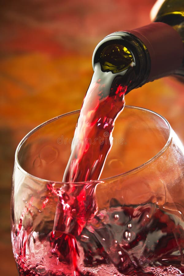 Red wine being poured stock image. Image of bottle, anniversary - 157122165