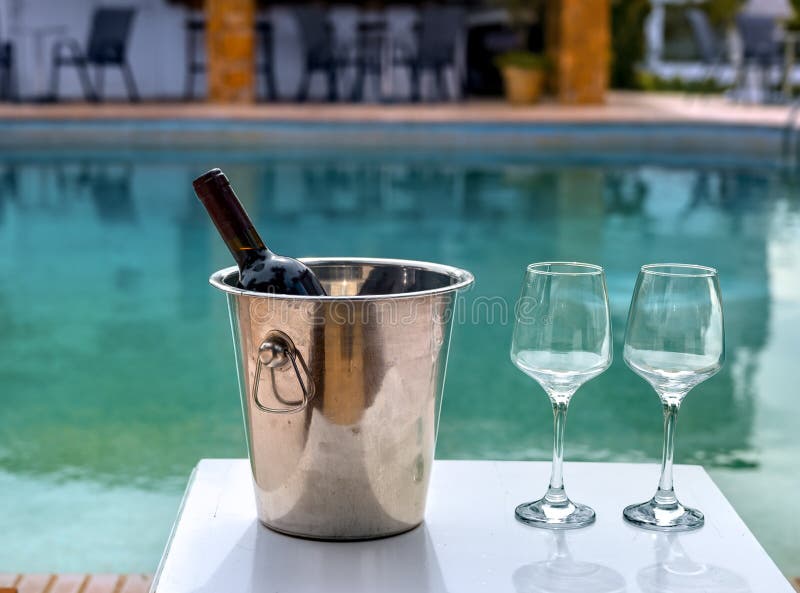 Red Wine Bottle and Glasses by the Hotel Pool Stock Image - Image of ...