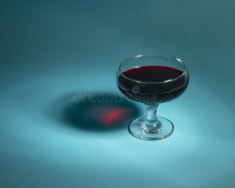Red Wine in Glass on Blue Background with Copy Space Stock Photo ...