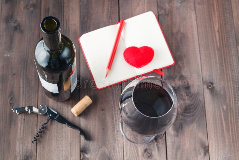 Red Wine Glass and Notebook on Table Stock Image - Image of heart ...