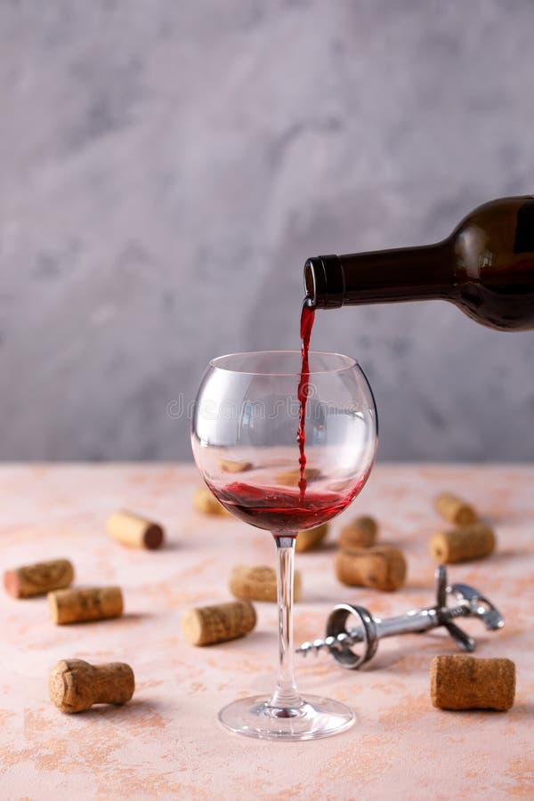 Red Wine is Poured into a Glass. the Concept of Winemaking Stock Photo ...