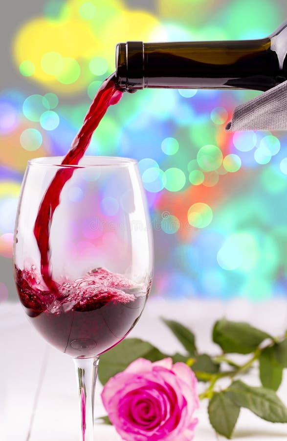 The Red Wine Splashing and Rose on the White Table Stock Photo - Image ... The Red Wine Splashing and Rose on the White Table Stock Photo - Image ...